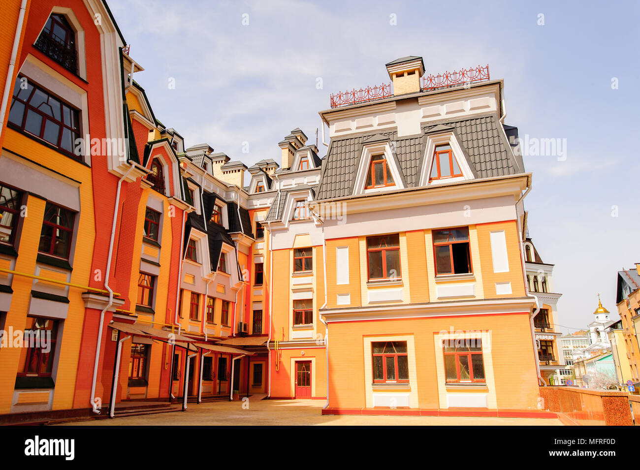 Different colored building Stock Photo - Alamy