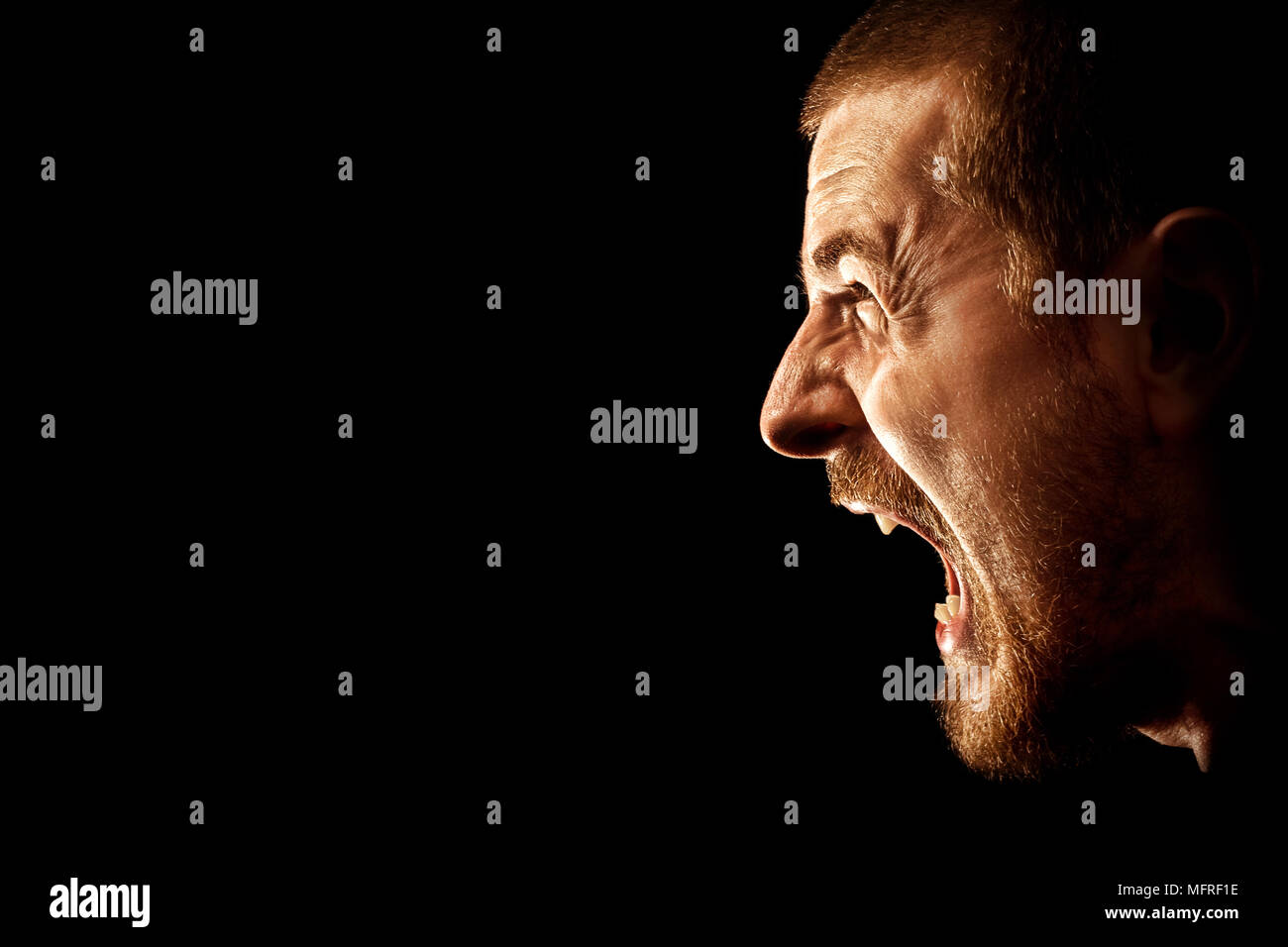 Scream of angry man with mad face expression Stock Photo - Alamy