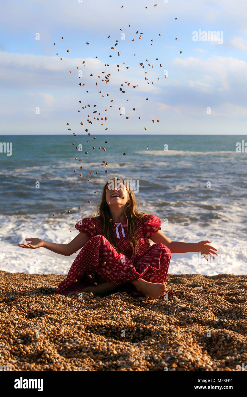 Woman throwing stone sea hi-res stock photography and images - Alamy