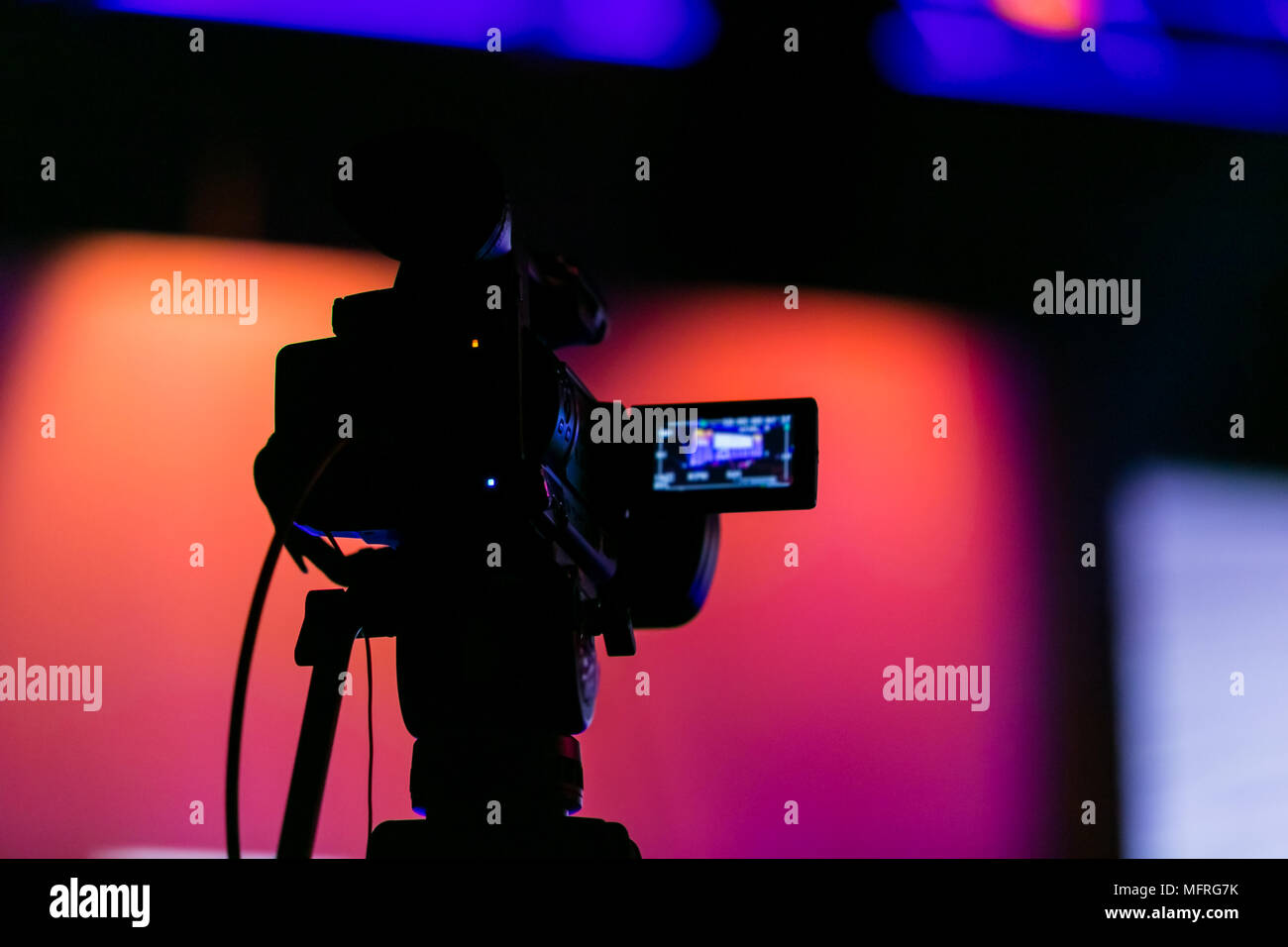 Silhouette of a TV Camera filming a live broadcast Stock Photo - Alamy