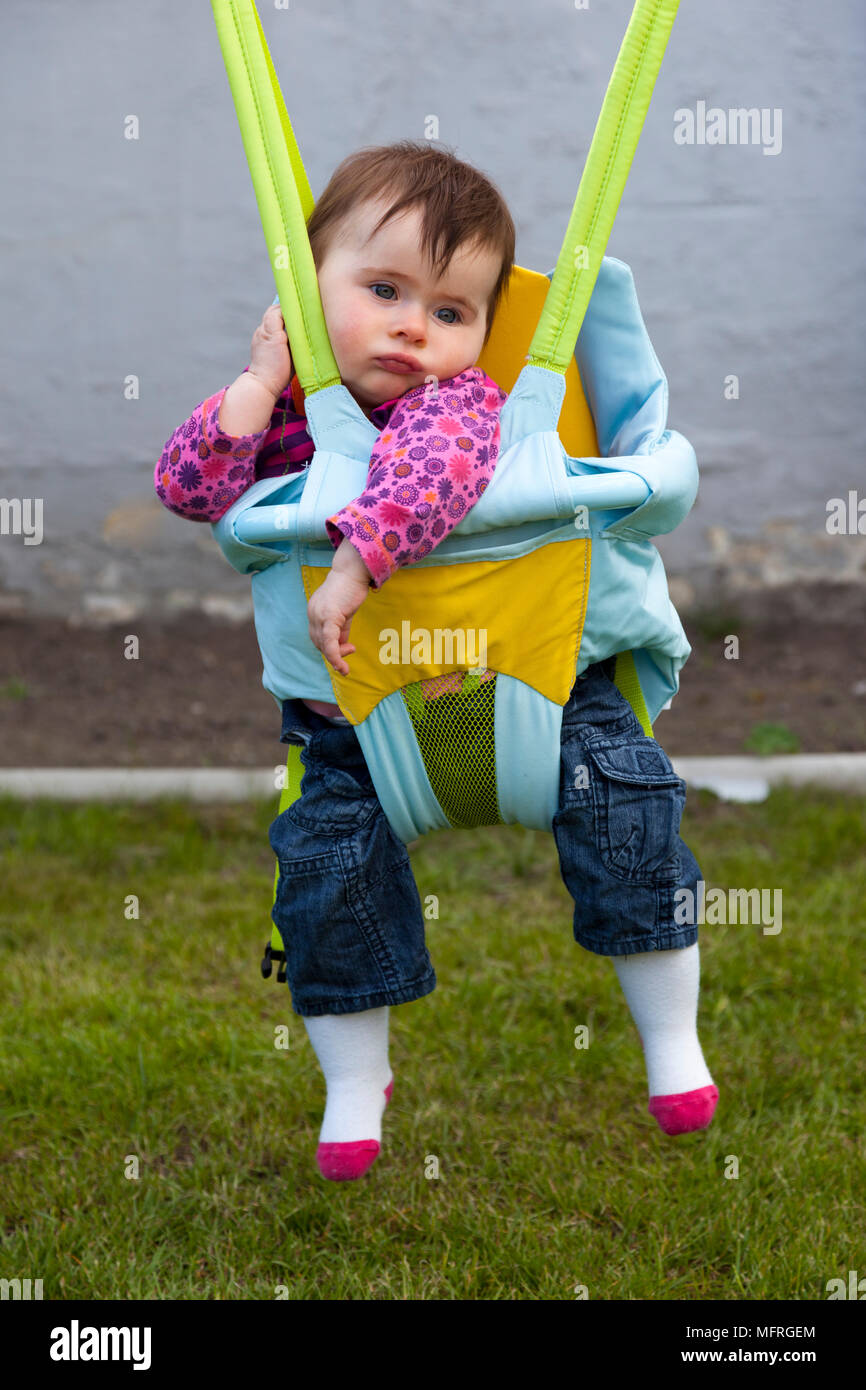 Bored baby on swing chair outdoors Model Release PS-016 Stock Photo - Alamy