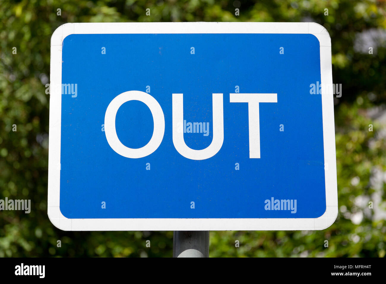 Blue and white OUT road sign with foilage background Stock Photo - Alamy