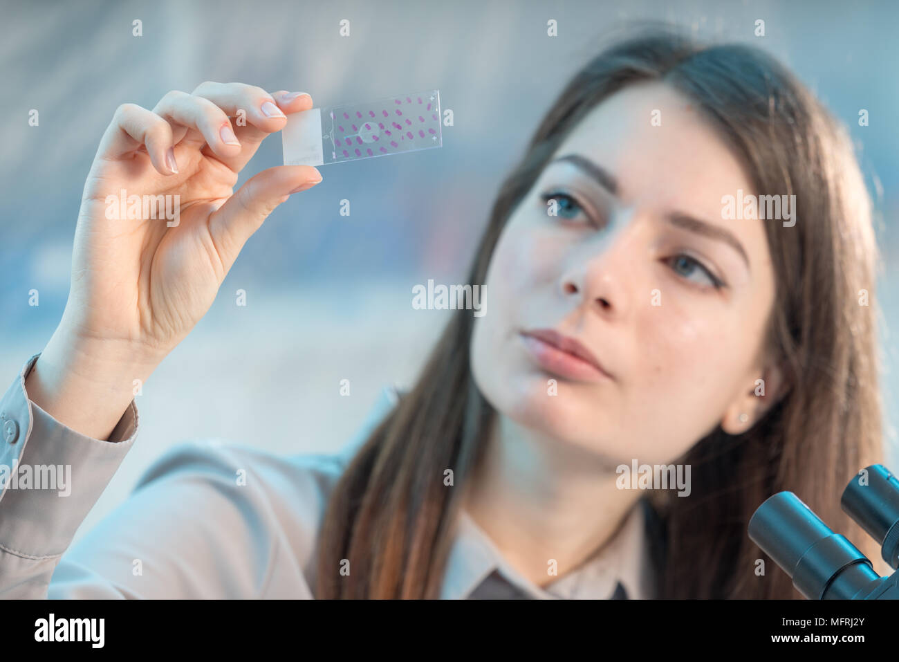 Girl with a slide for the microscope University Hospital Stock Photo ...
