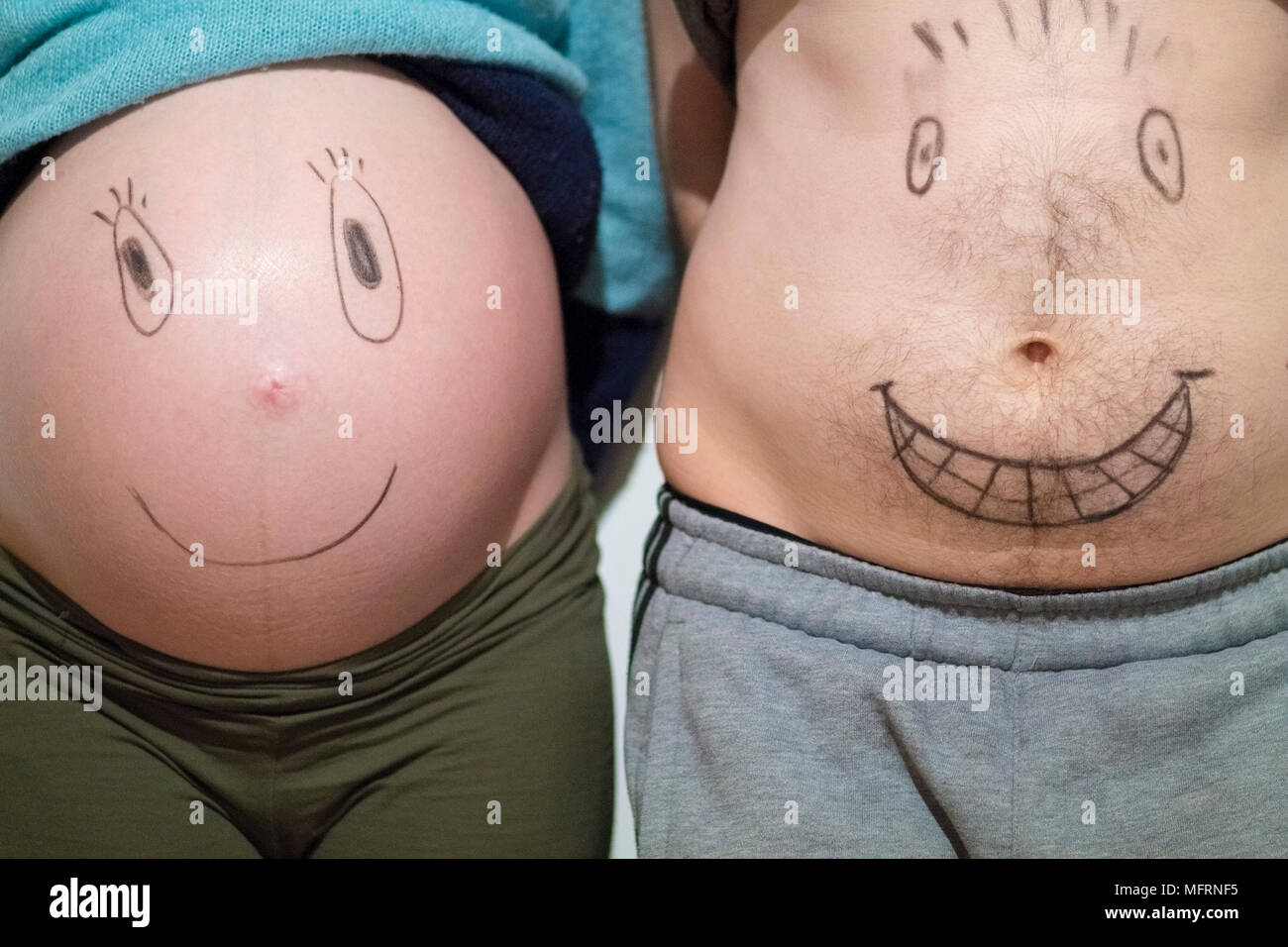 Pregnant woman drawing happy face hi-res stock photography and images ...