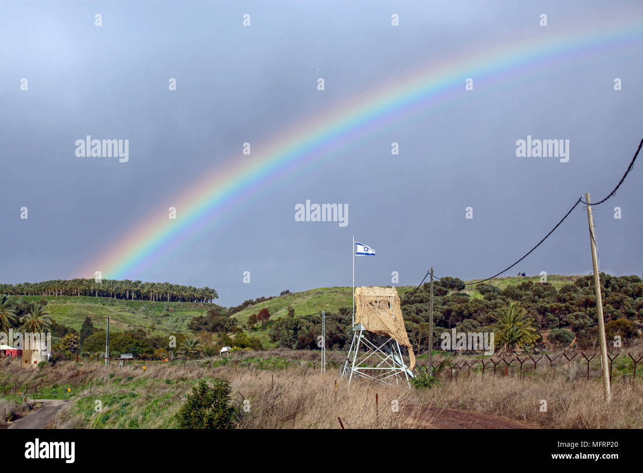 Rainbow over the Israeli flag. Photographed at the Isle of Peace at the ...