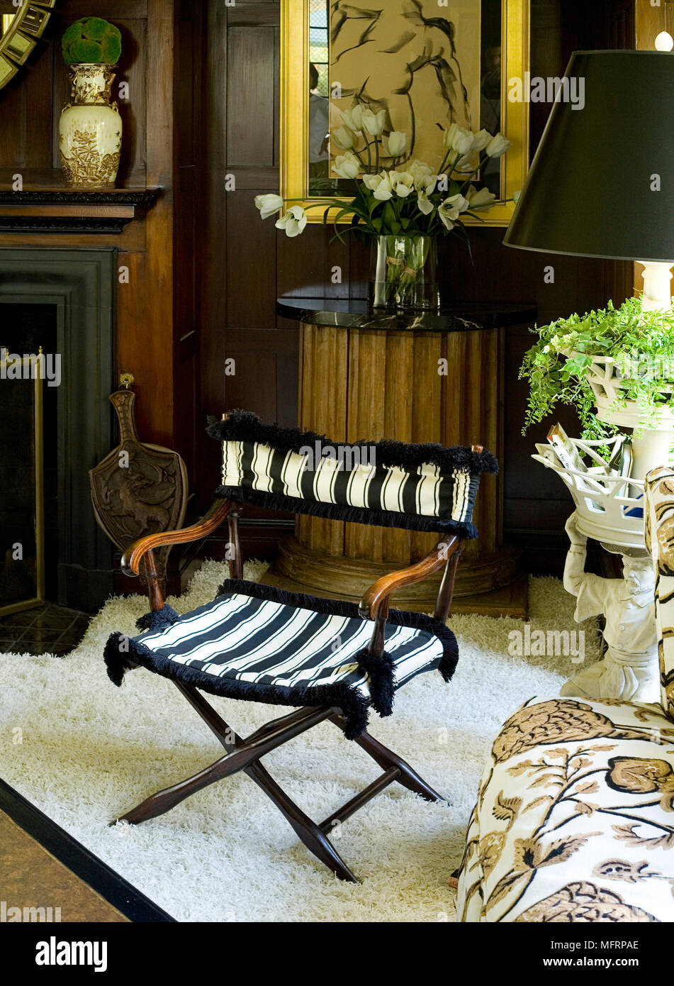 Folding chair in traditional style sitting room Stock Photo - Alamy