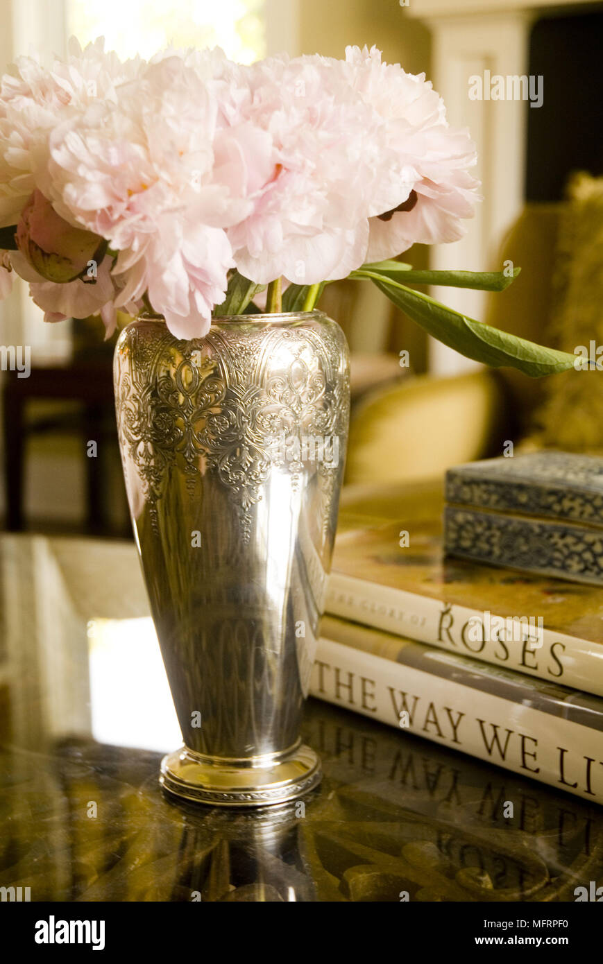 Flower arrangement in silver vase Stock Photo - Alamy