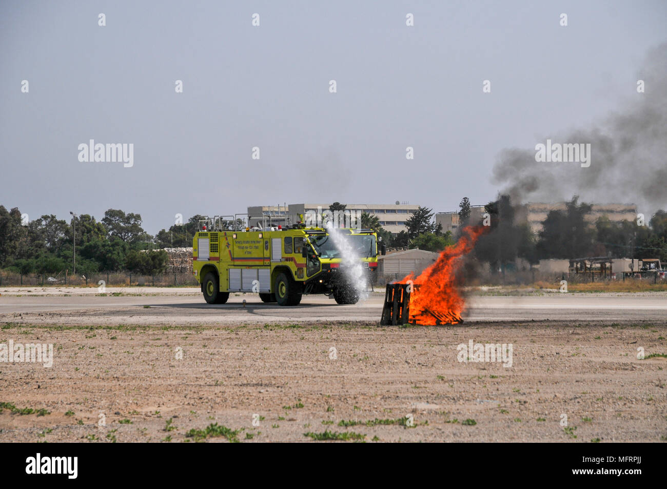 Israel Airport Authority fire truck extinguishes a fire during a ...