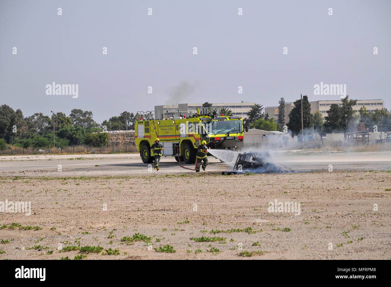 Israel Airport Authority fire truck extinguishes a fire during a ...