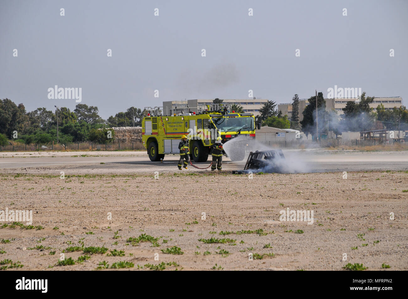 Israel Airport Authority fire truck extinguishes a fire during a ...