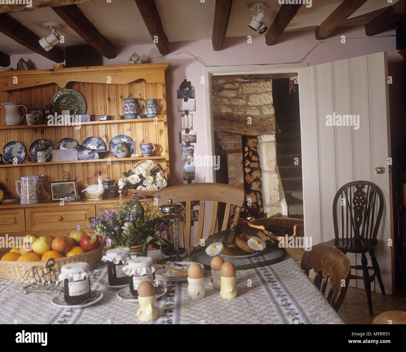 Dining table ready for breakfast in country style kitchen Stock Photo ...