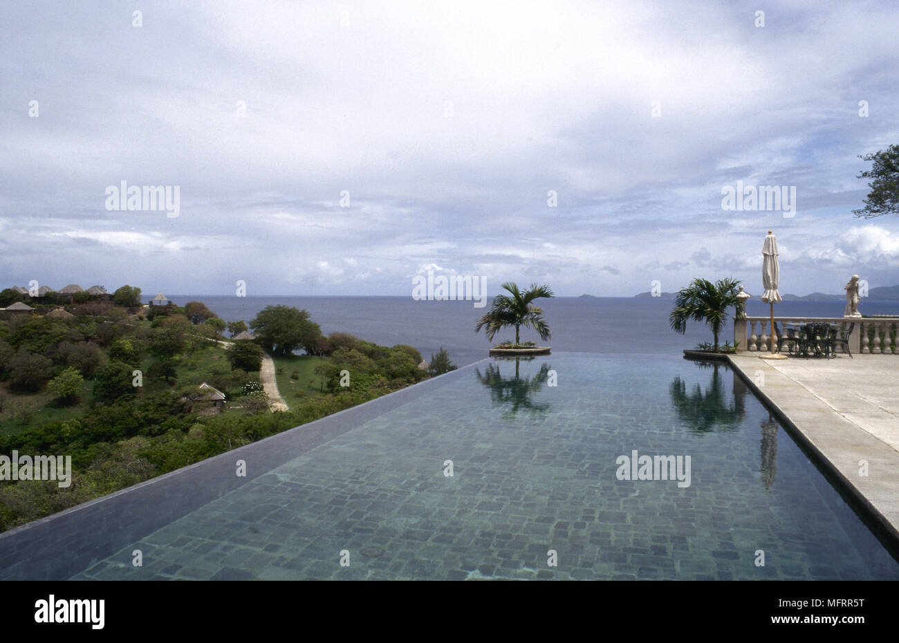 Outdoor, Ocean side swimming pool with mosaic stone floor, a negative ...