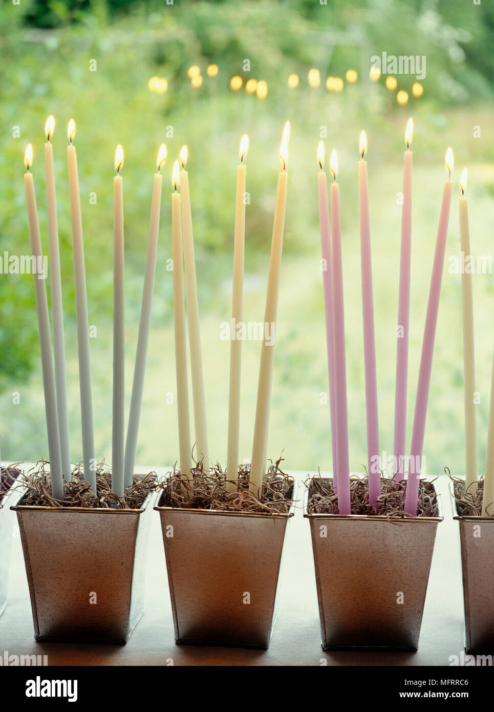 Coloured candles lit hi-res stock photography and images - Alamy