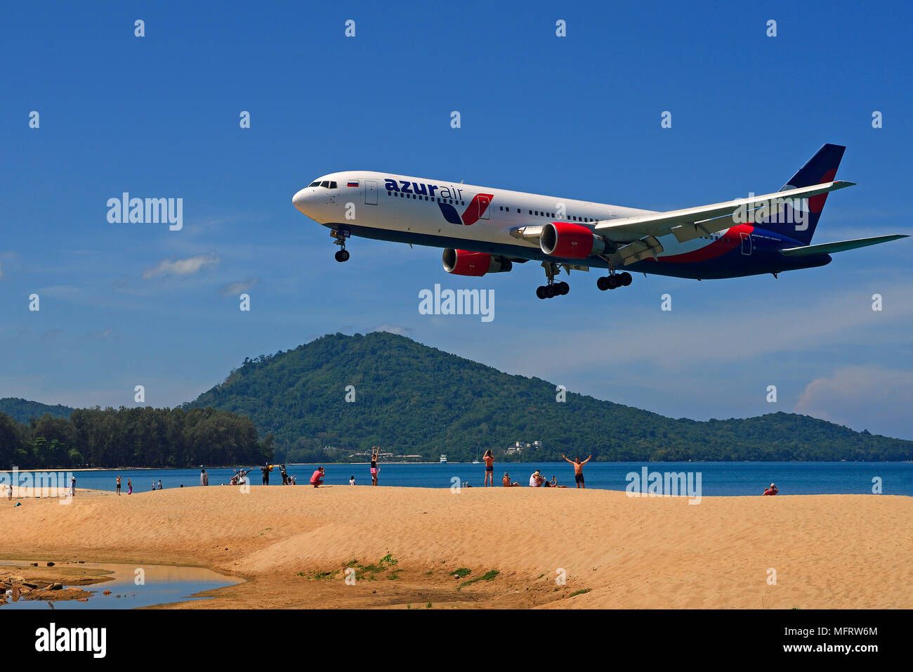 Airplane Azur Air landing over sandy beach, Mai Kao Beach, Phuket ...