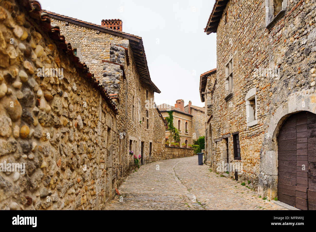 Narrow street in Perouges, France, a medieval walled town, a popular ...