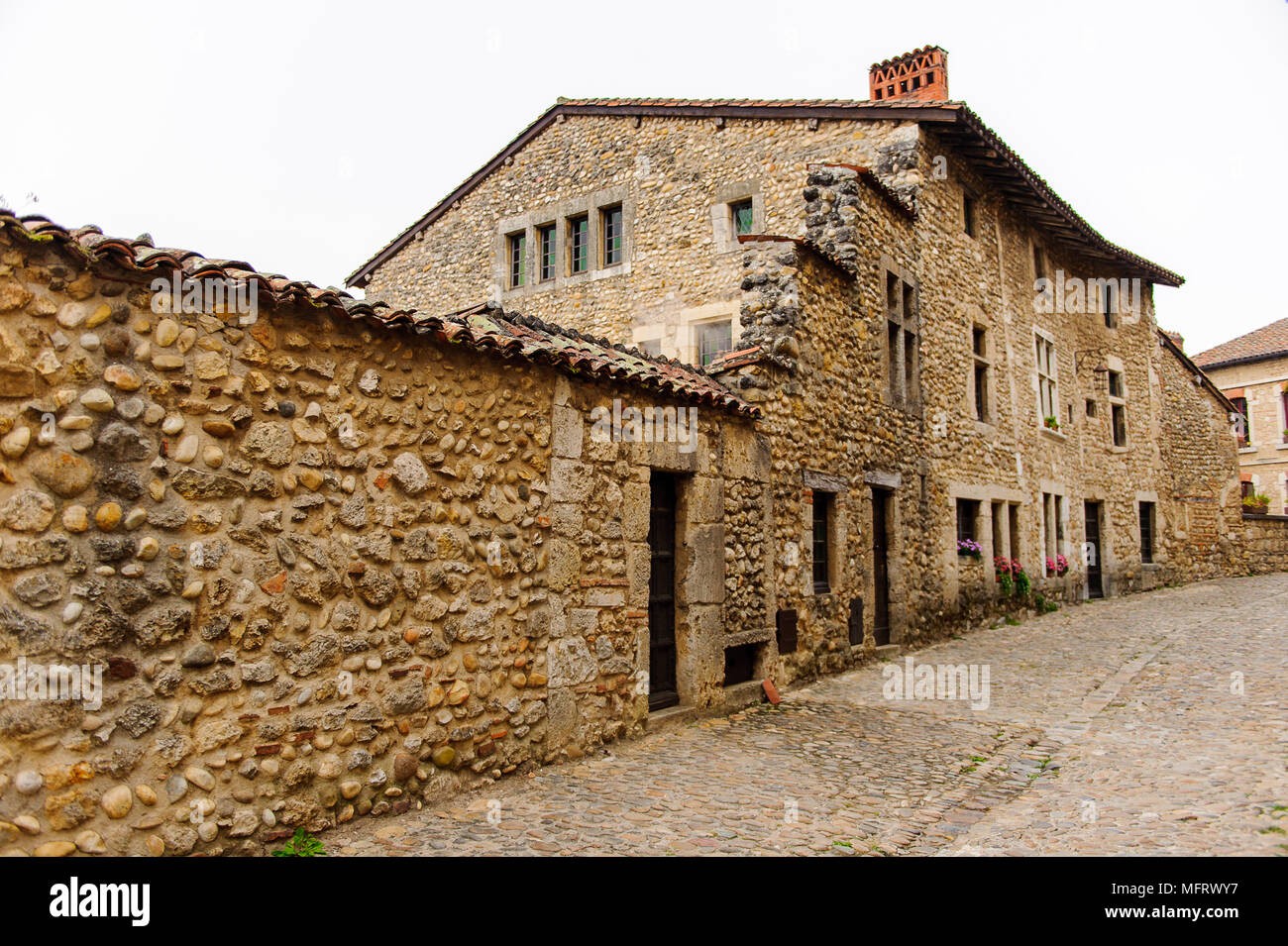 Narrow street in Perouges, France, a medieval walled town, a popular ...
