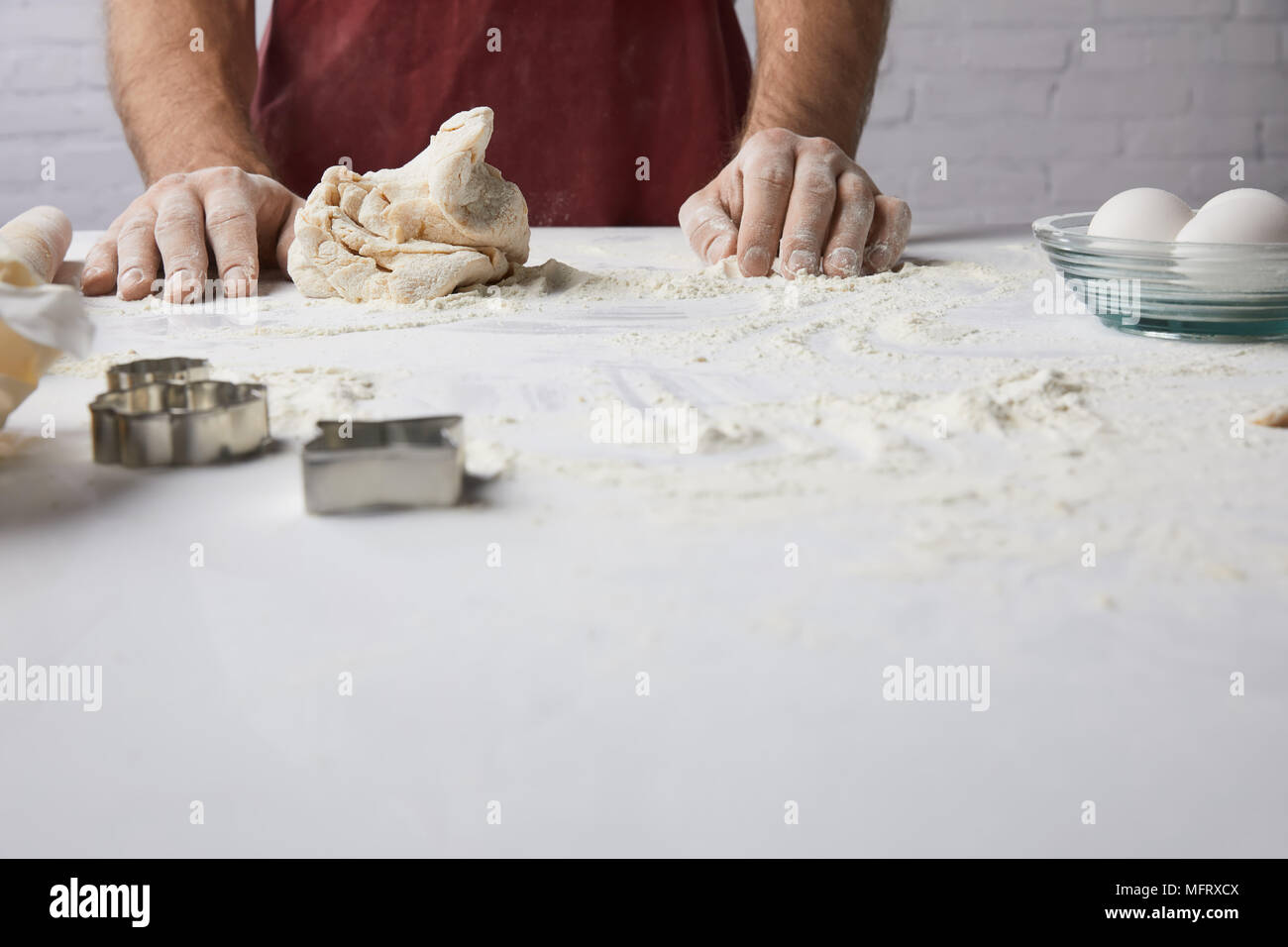 cropped image of chef standing at table with dough Stock Photo - Alamy