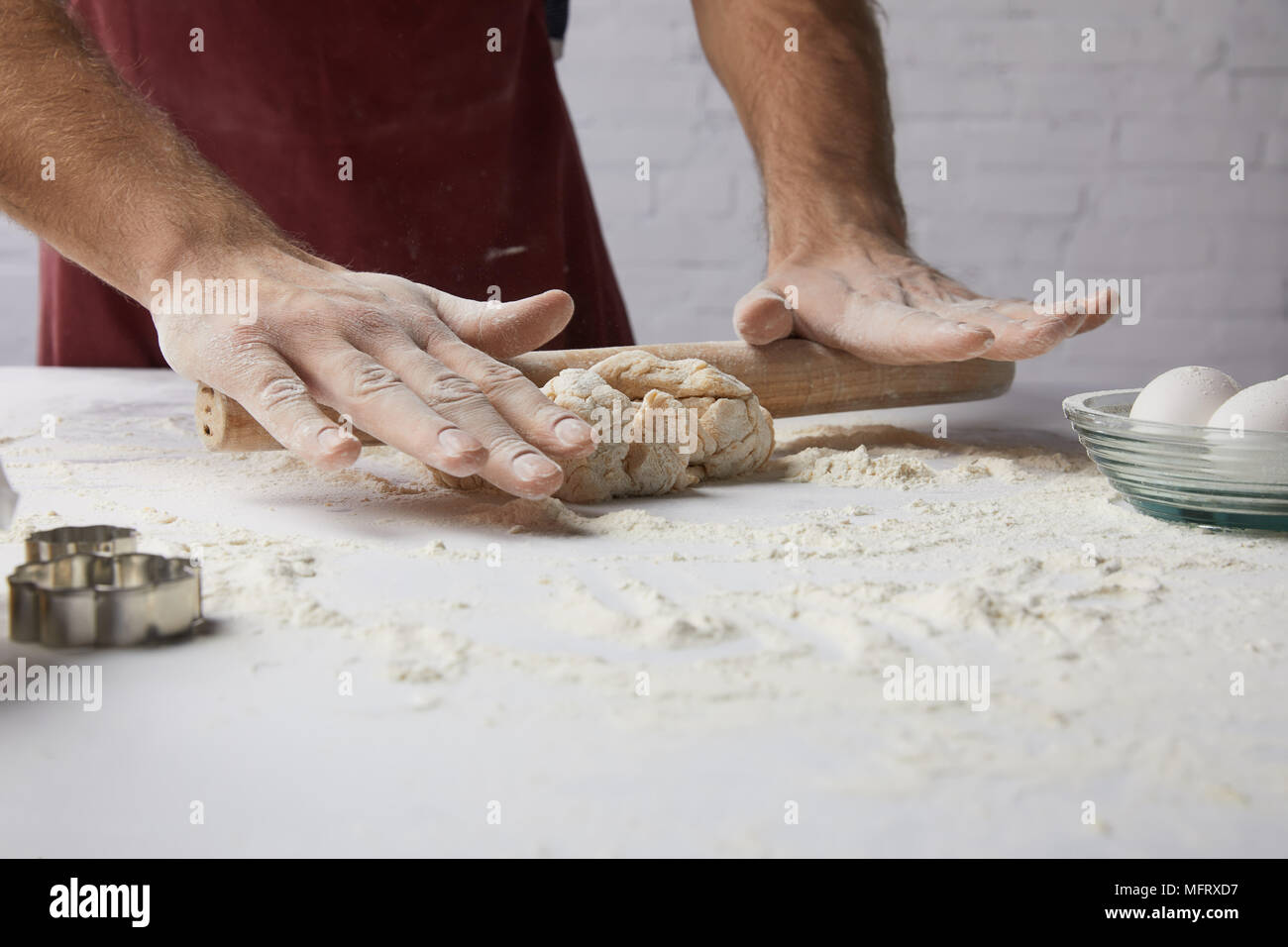 cropped image of chef rolling dough with rolling pin Stock Photo - Alamy