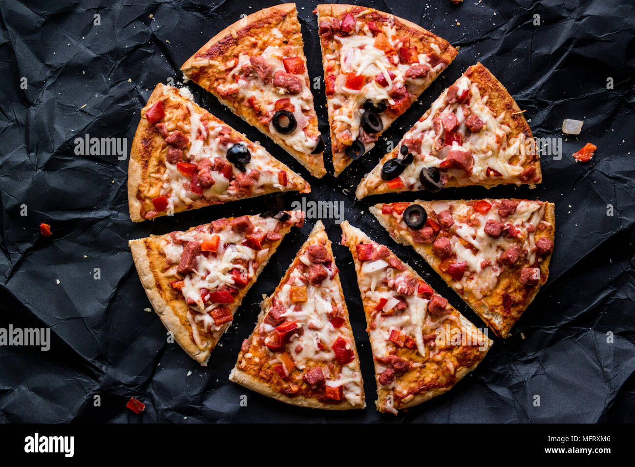Pizza is a flatbread generally topped with tomato sauce and cheese and ...