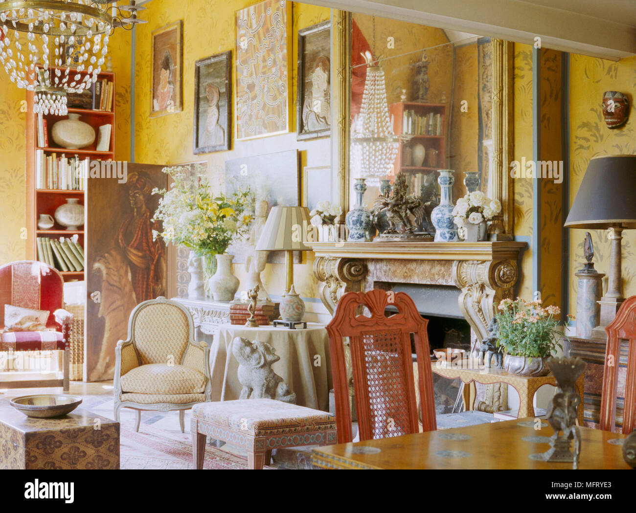 A traditional yellow sitting room decorated in an opulent style with ...