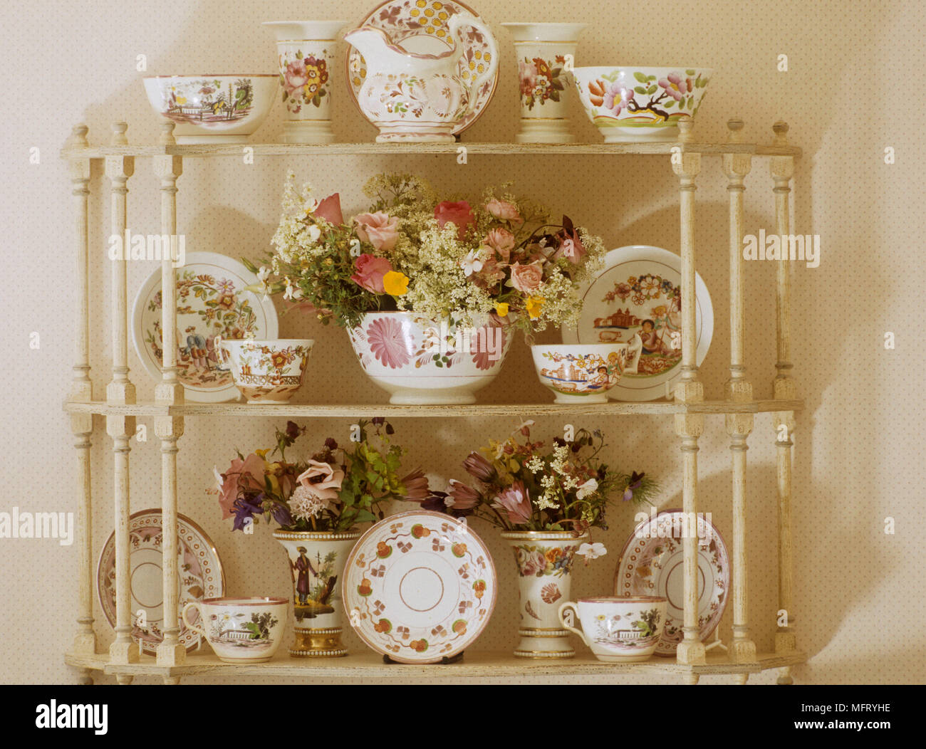 Detail of cabinet with display of china and flower arrangements Stock ...