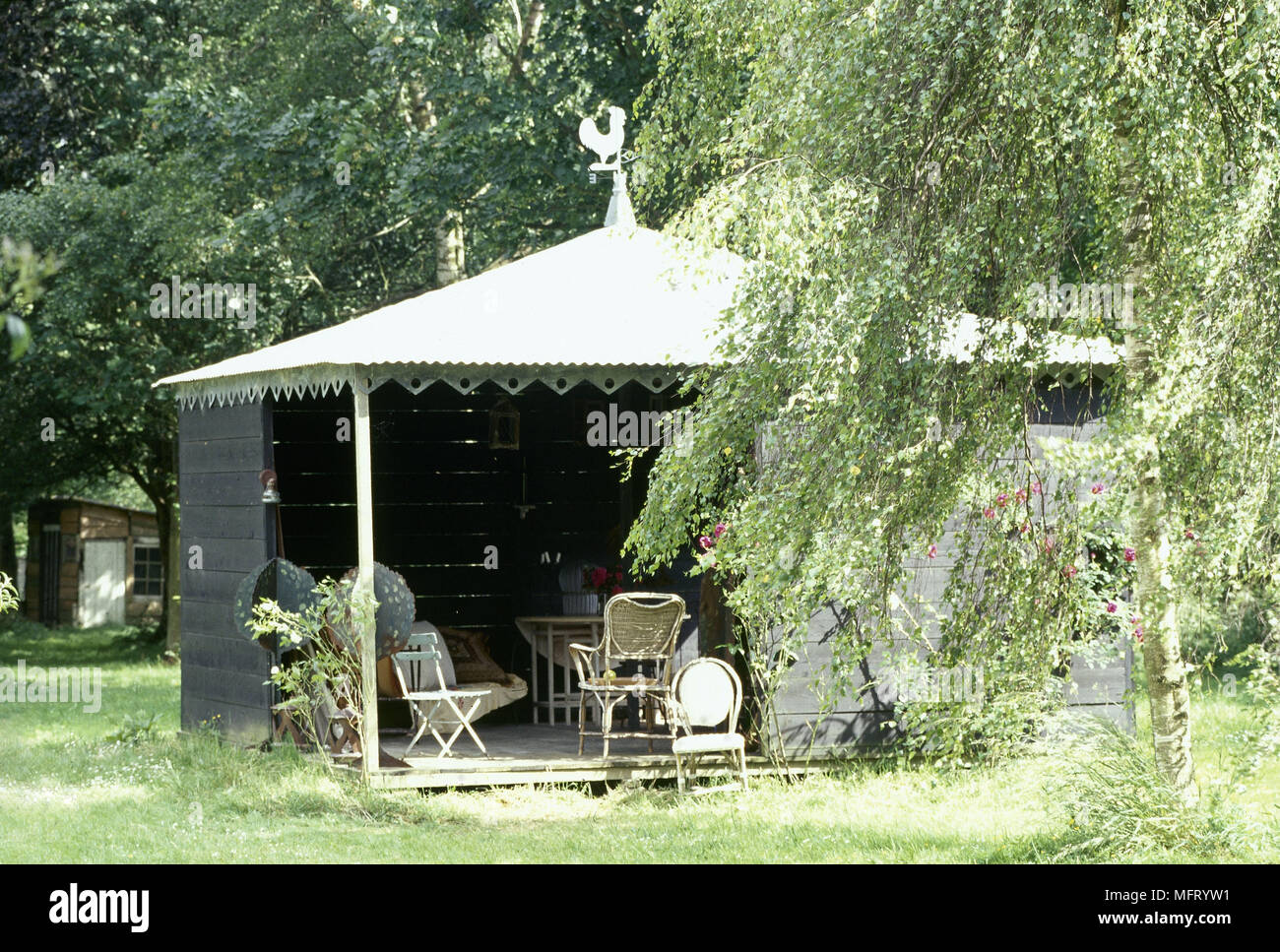 Wooden summer house table and chairs outside outdoors covered patio ...