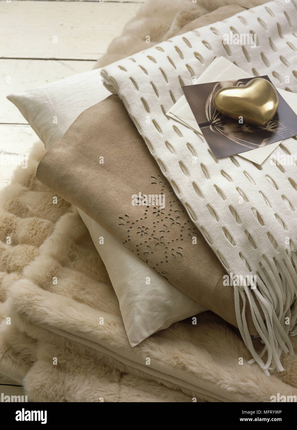 Fabrics and furry cushion covers in neutral colours Stock Photo - Alamy