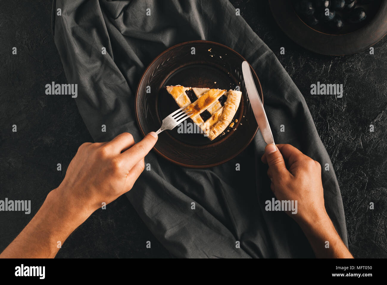man eating berry pie Stock Photo - Alamy