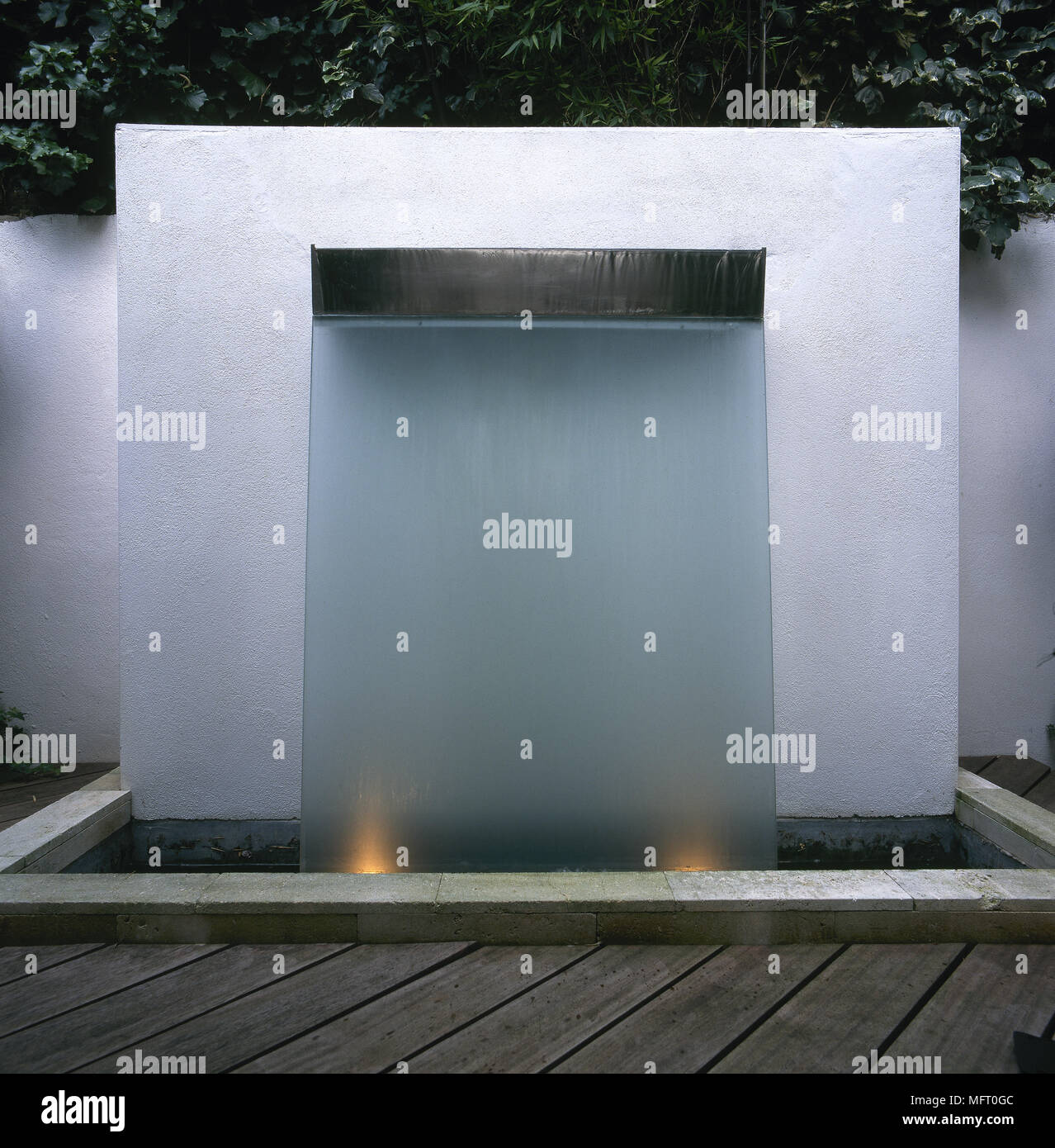 Modern garden water feature with frosted glass and back lighting Stock ...