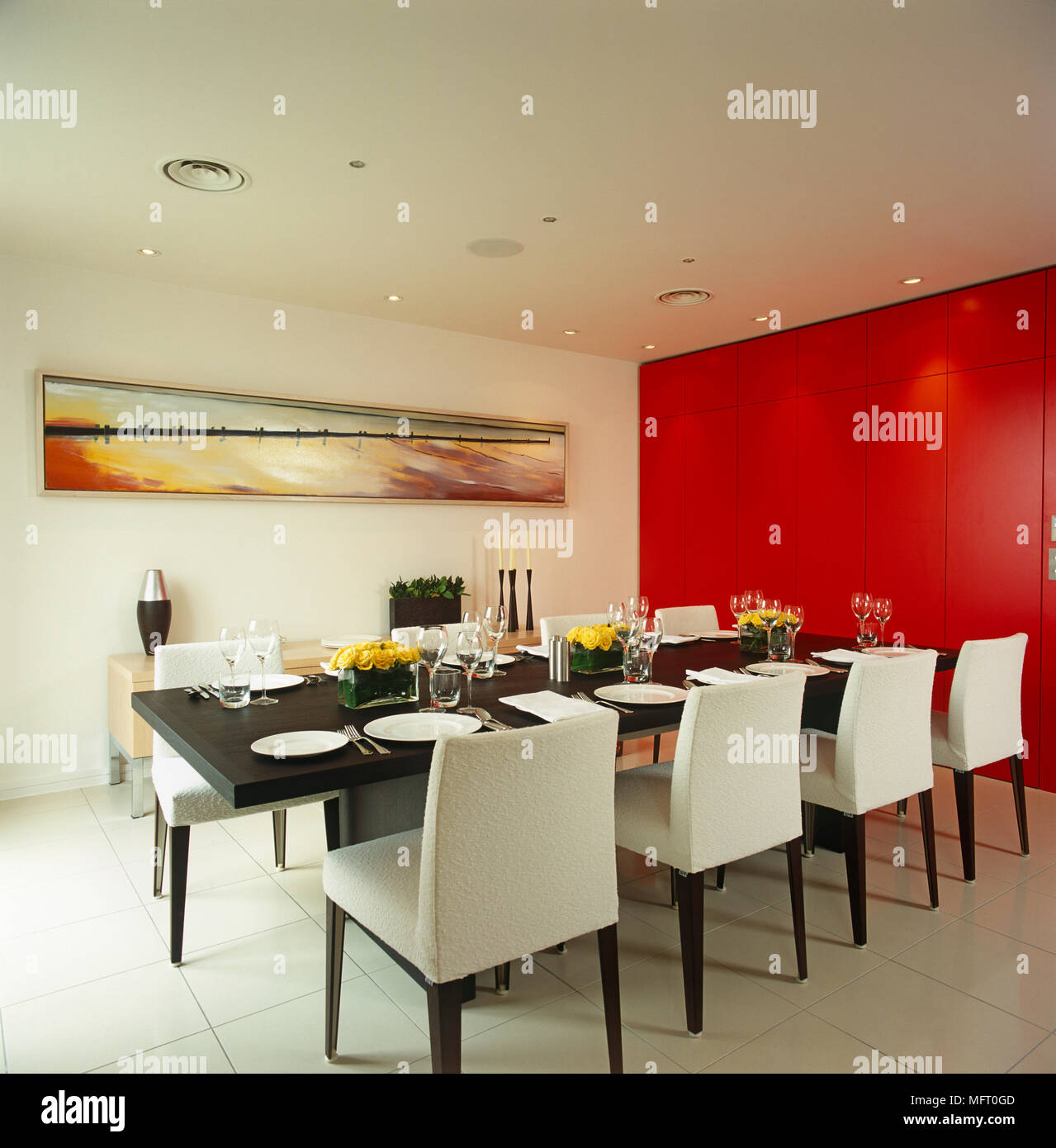 White upholstered chairs at long dining table in contemporary dining ...