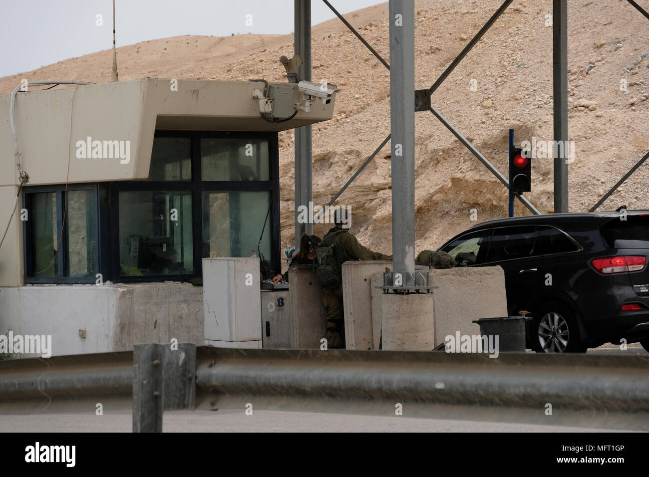 Israeli cars driving through Israeli military checkpoint on highway 90 ...