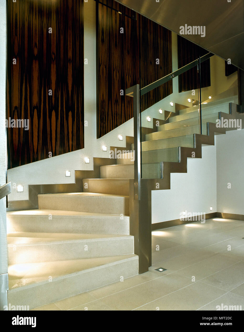 A modern hallway with staircase, tiled floor, lit steps Stock Photo - Alamy