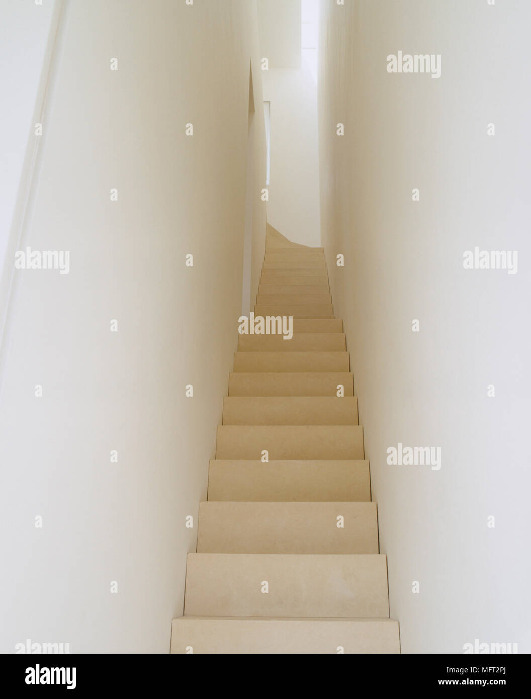 A modern, narrow minimalist staircase with stone steps Stock Photo - Alamy