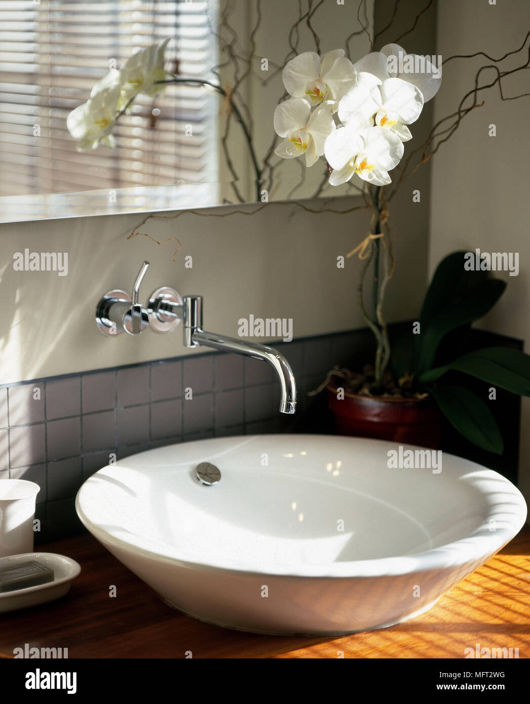 Washbasin set on shelf with chrome tap fitting Stock Photo - Alamy