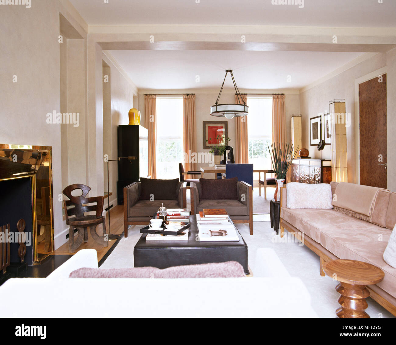 Traditional open plan sitting room sofa upholstered ottoman armchairs ...