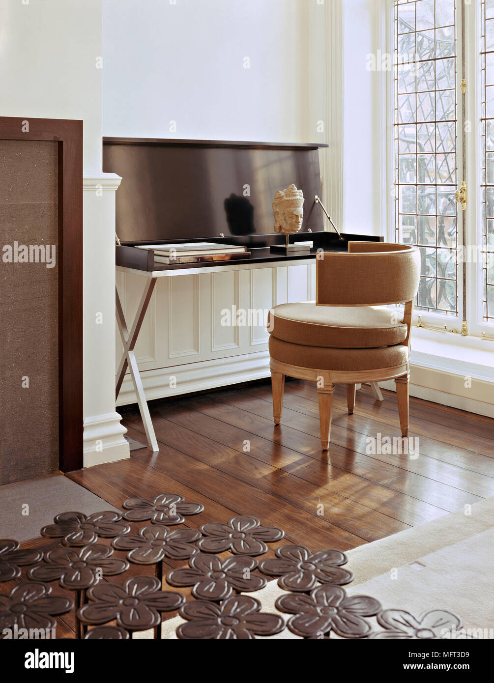 Modern desk with open lid upholstered chair wood floor Interiors detail ...
