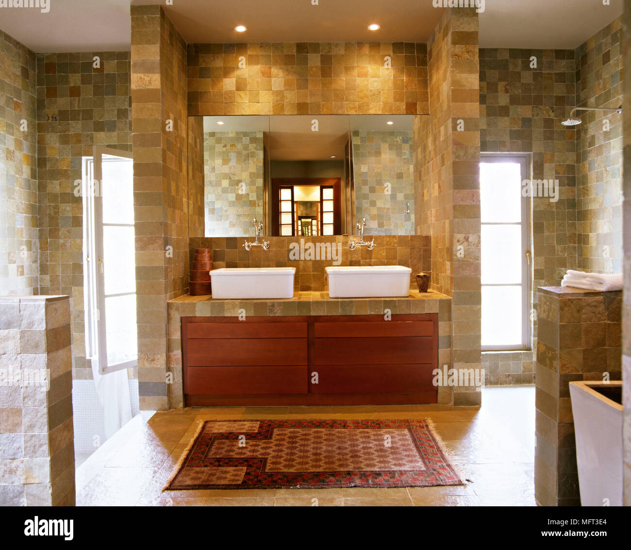 Modern bathroom tiled walls twin washbasins set on drawer unit ...