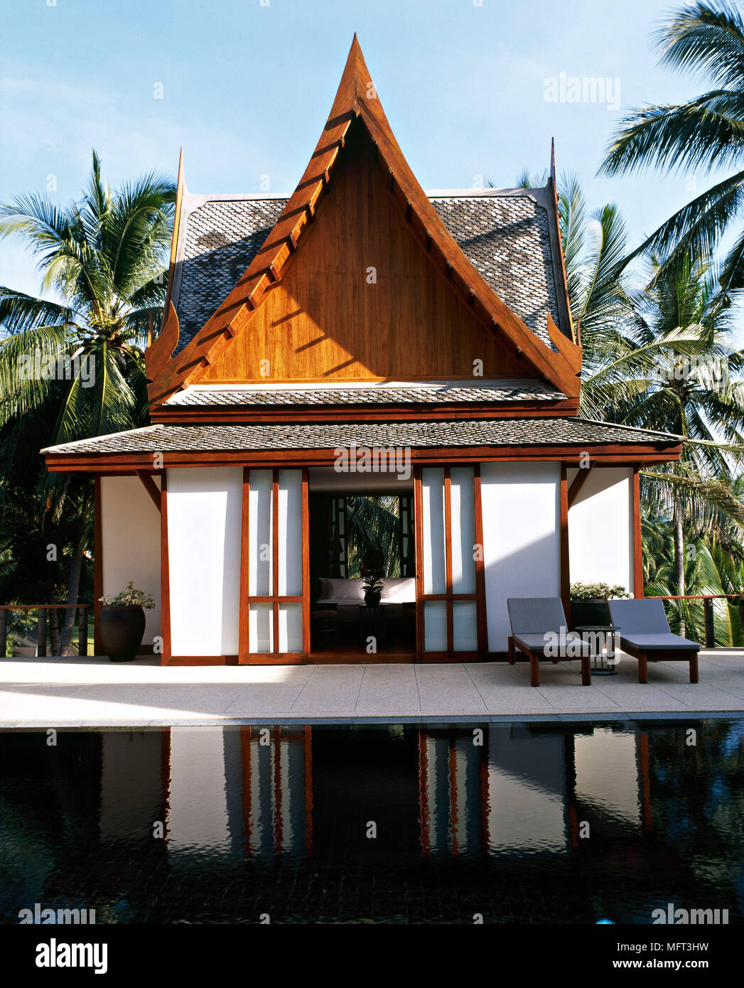 Exterior of Thai hotel terrace sun loungers swimming pool; Exteriors ...