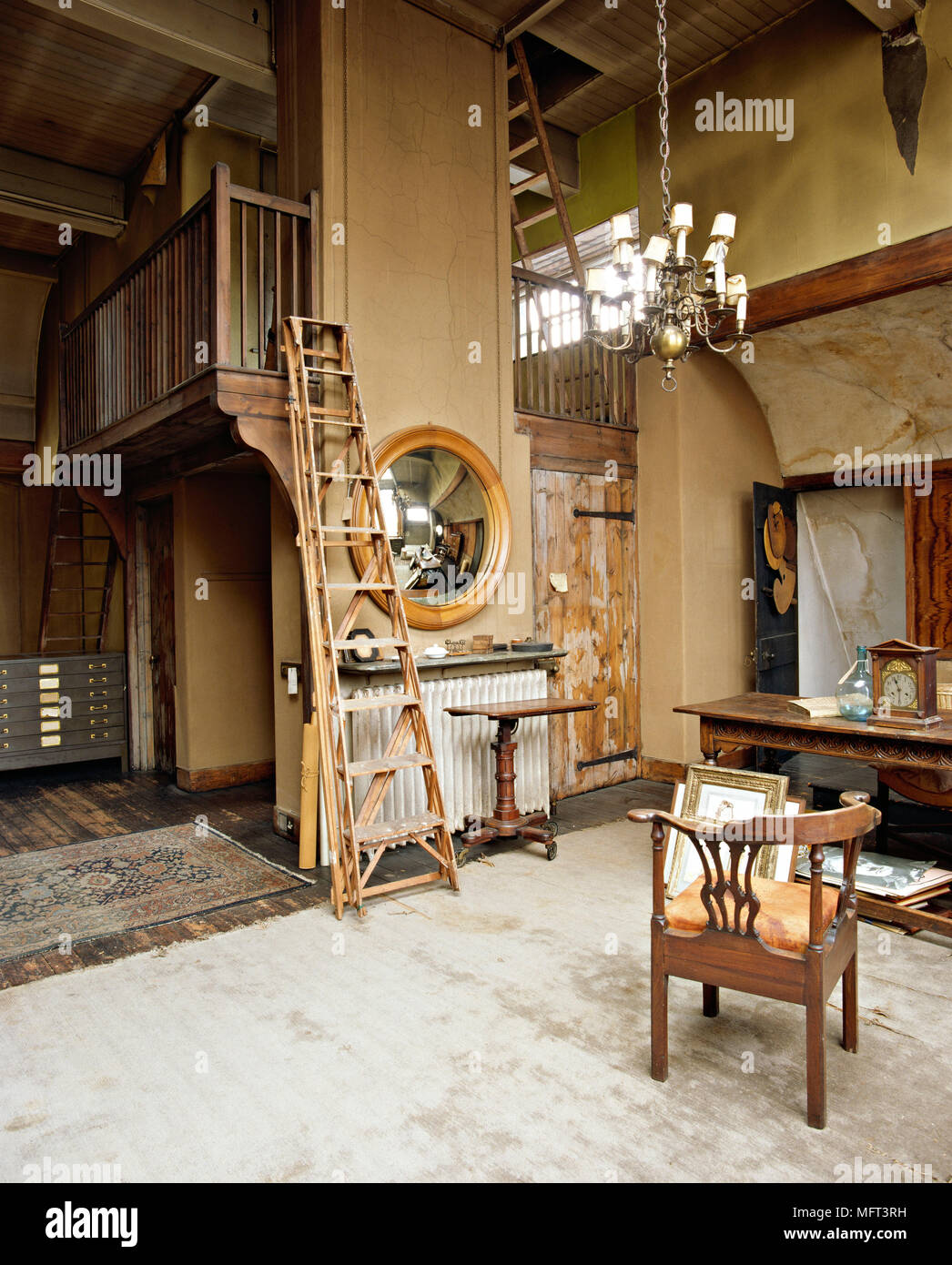 Artists studio with an old fashioned traditional feel table chair ...