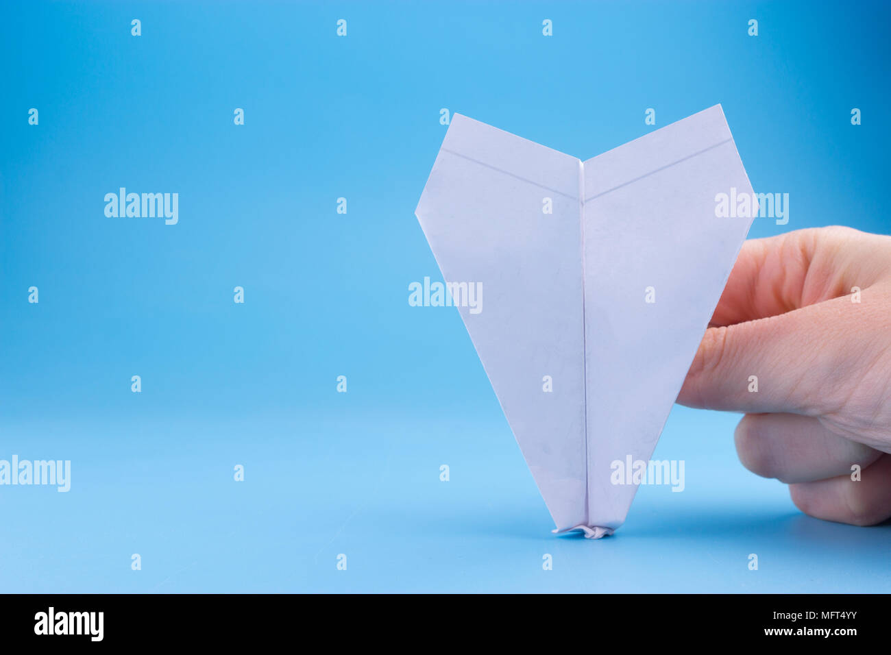 plane crash concept. paper plane upside down on blue background Stock ...