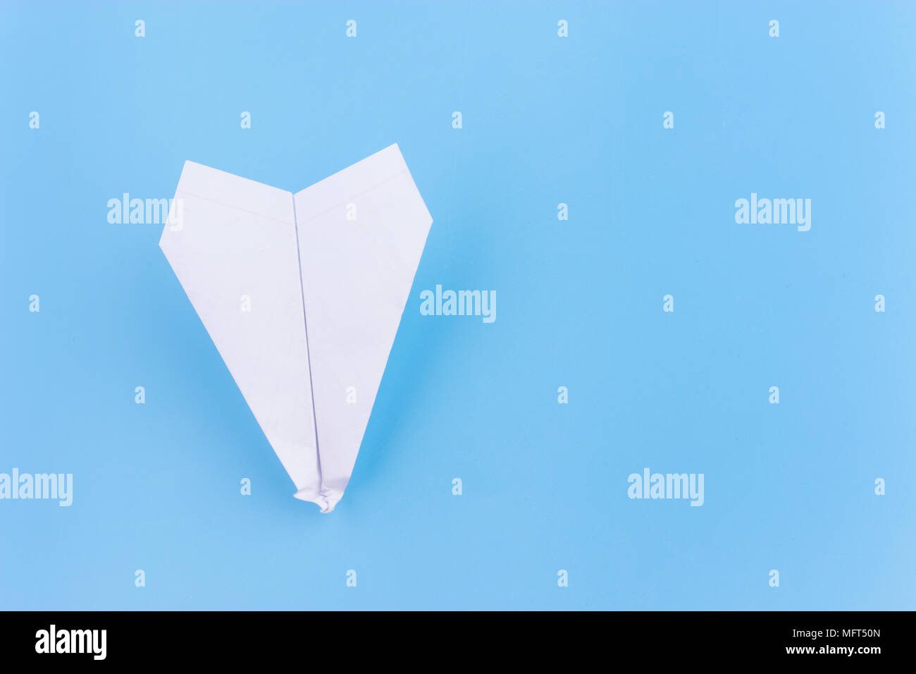 plane crash concept. paper plane upside down on blue background Stock ...