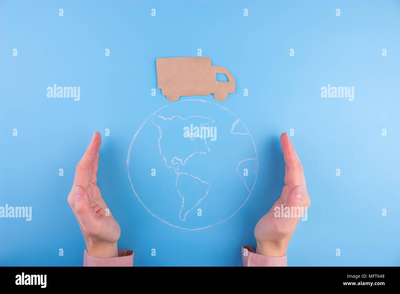 paper lorry on the earth planet. delivery concept Stock Photo - Alamy
