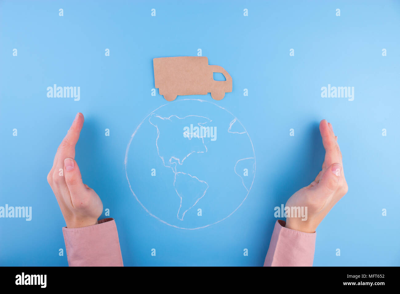 paper lorry on the earth planet. delivery concept Stock Photo - Alamy