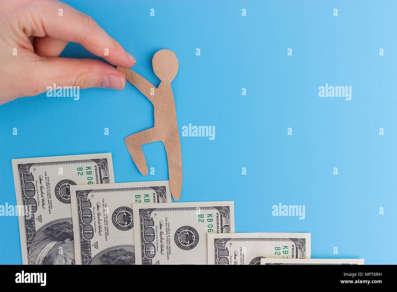 woman hand held cartoon person go up. team worl concept Stock Photo - Alamy