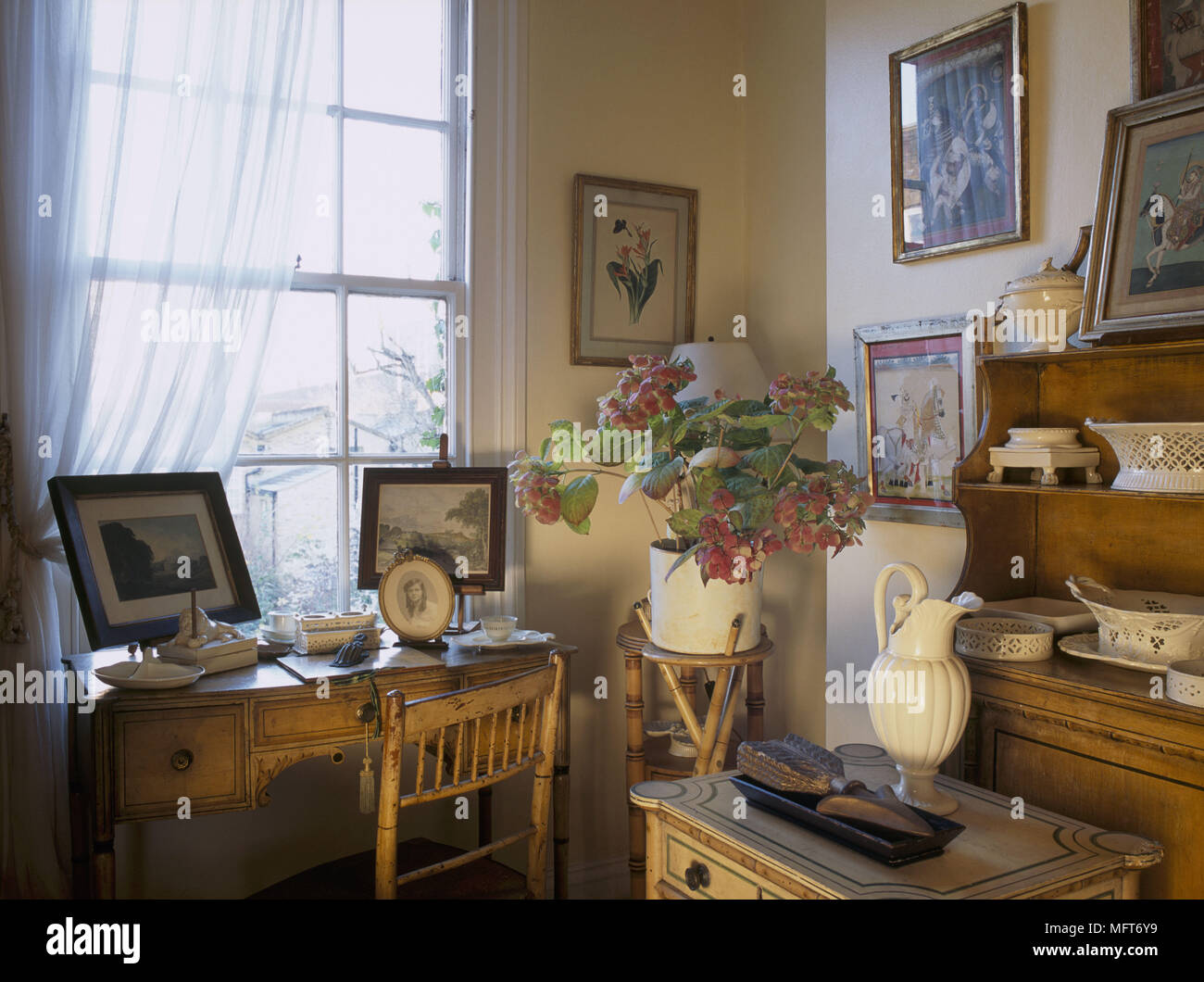A traditional country study with wooden desk and chair dresser painted ...