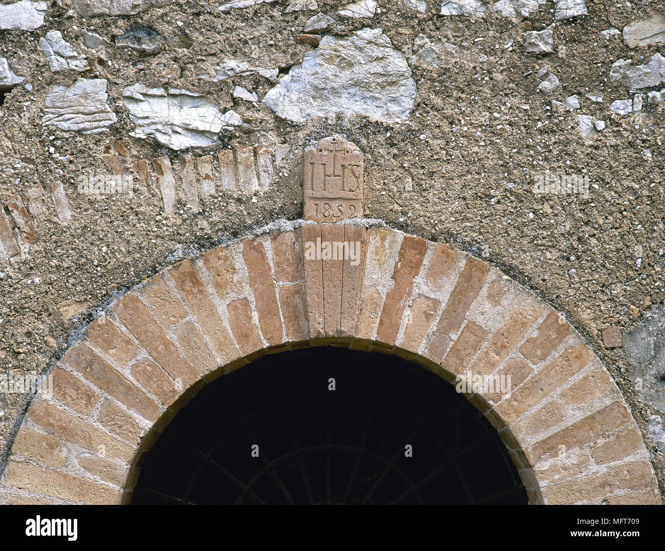 Detail rough stone walls brickwork arch stone dated 1852 rustic bricks ...