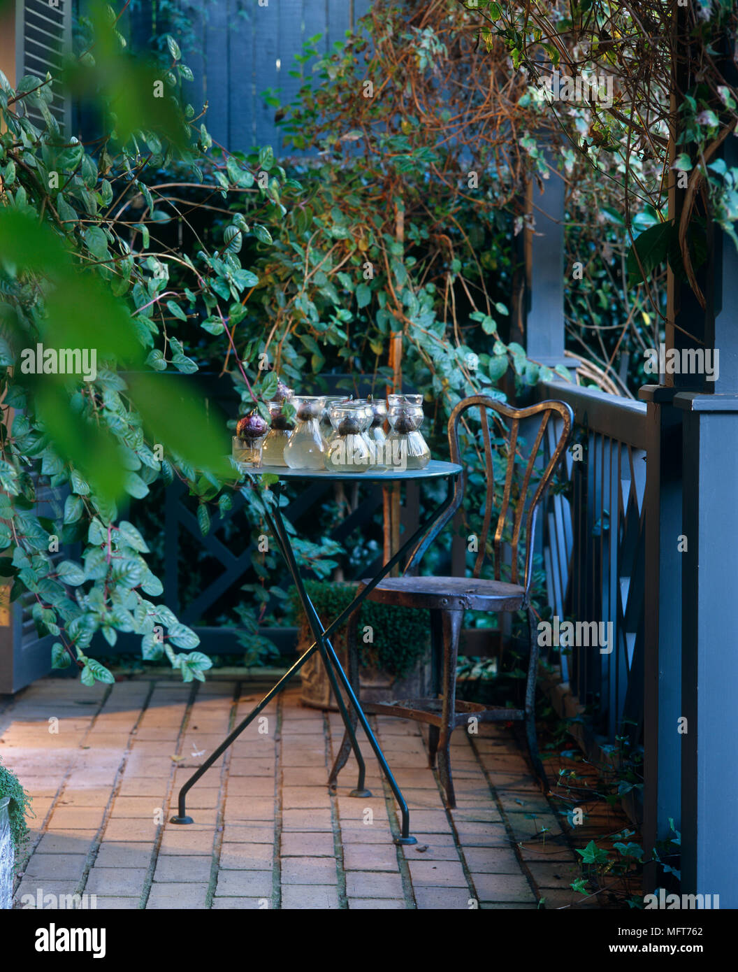 Wooden table and chair on tiled balcony veranda Stock Photo - Alamy