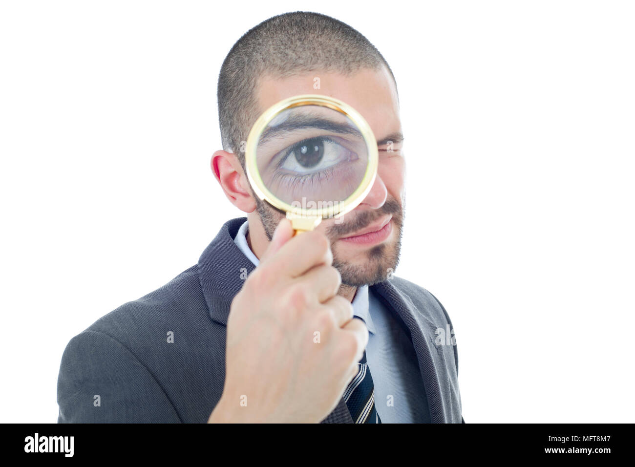 Isolated young business man with magnifying glass Stock Photo - Alamy