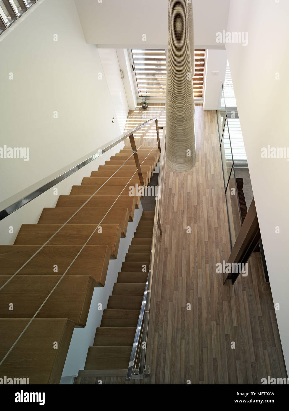Elevated view of staircase in contemporary hallway Stock Photo - Alamy