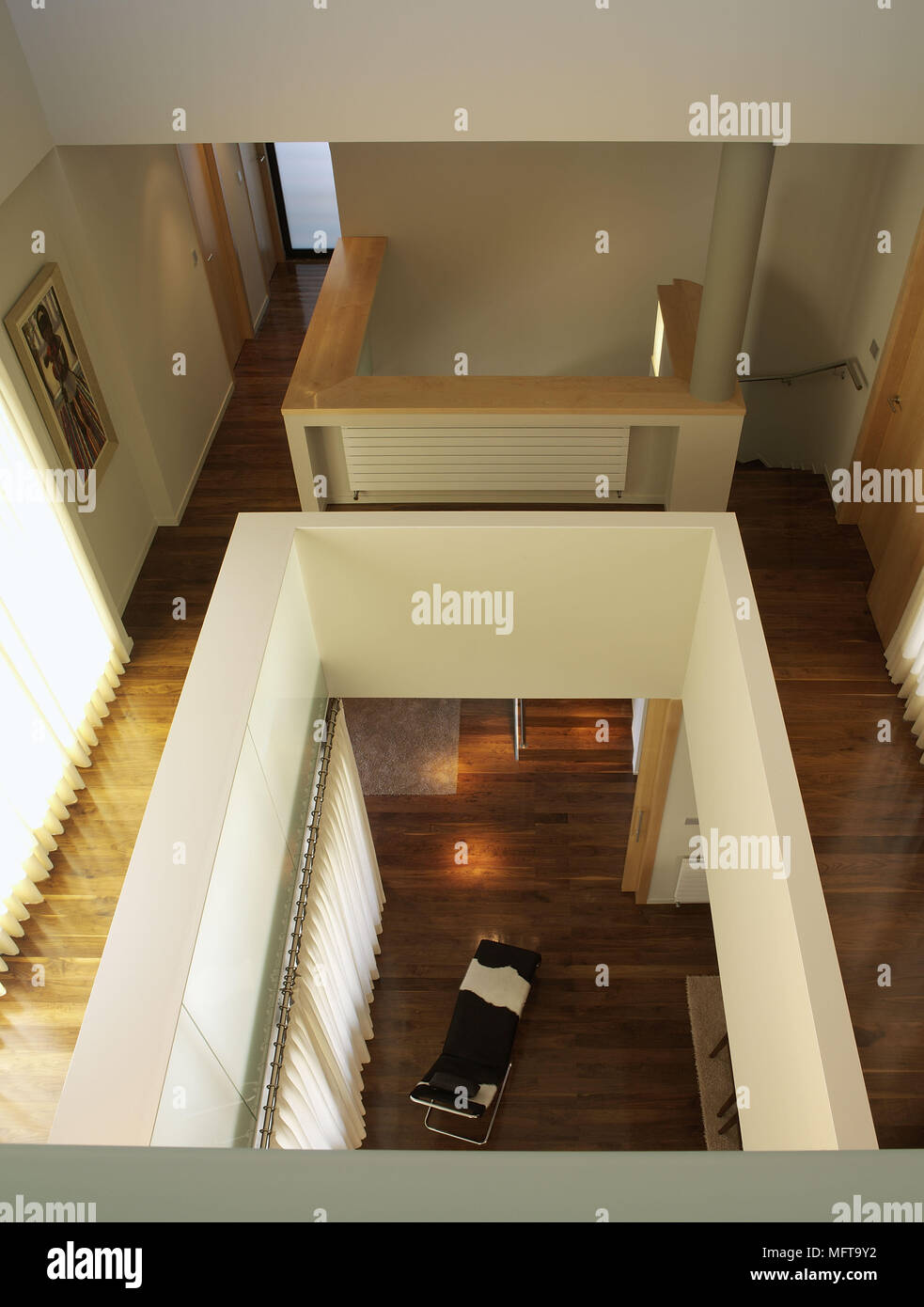 Elevated view of upper landing with room below Stock Photo - Alamy